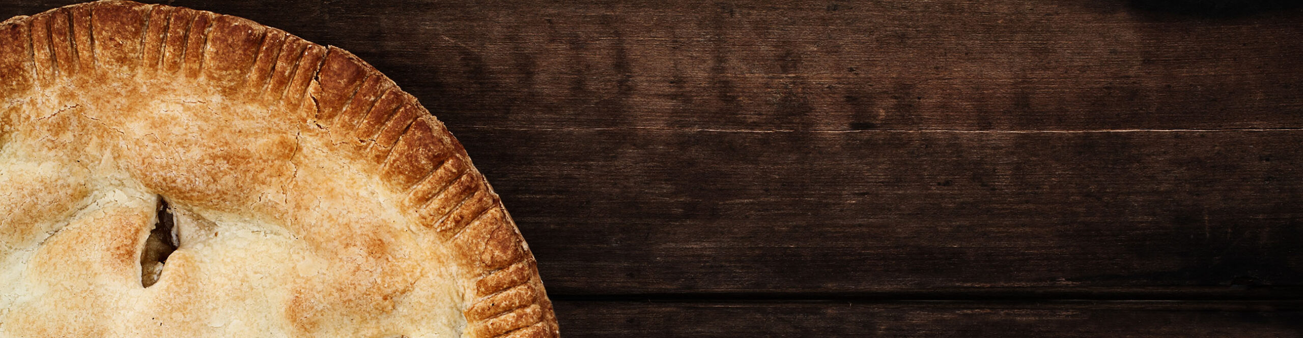 Apple Pie Over a Dark Wooden Table Top – Yadkin Valley Magazine